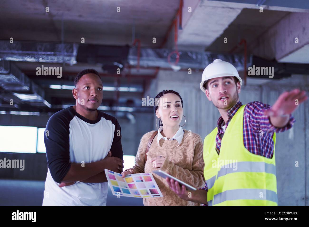 architect engineer using tablet computer while showing house design ...