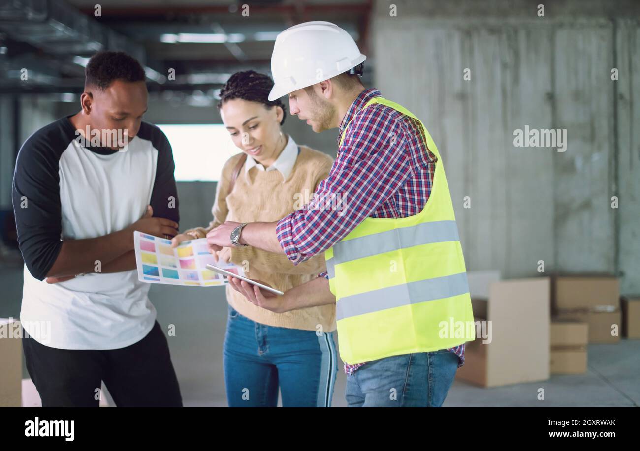 architect engineer using tablet computer while showing house design ...