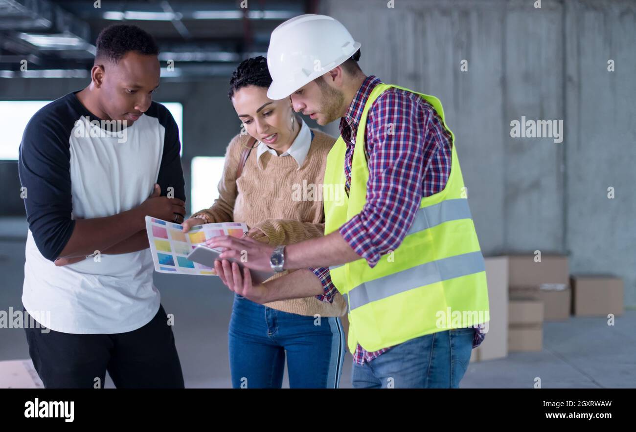 architect engineer using tablet computer while showing house design ...