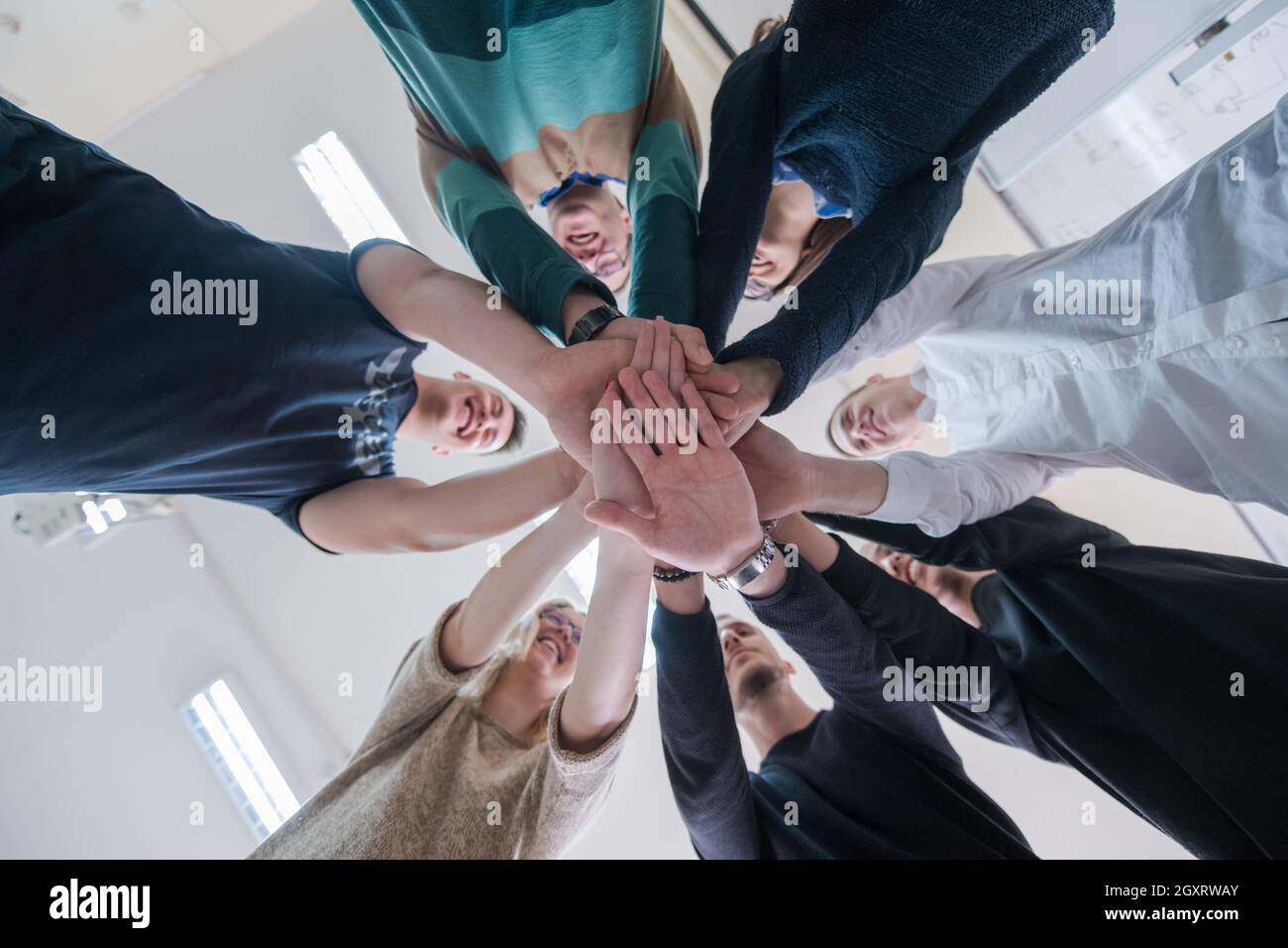 Group of young students in electronics classroom celebrating ...