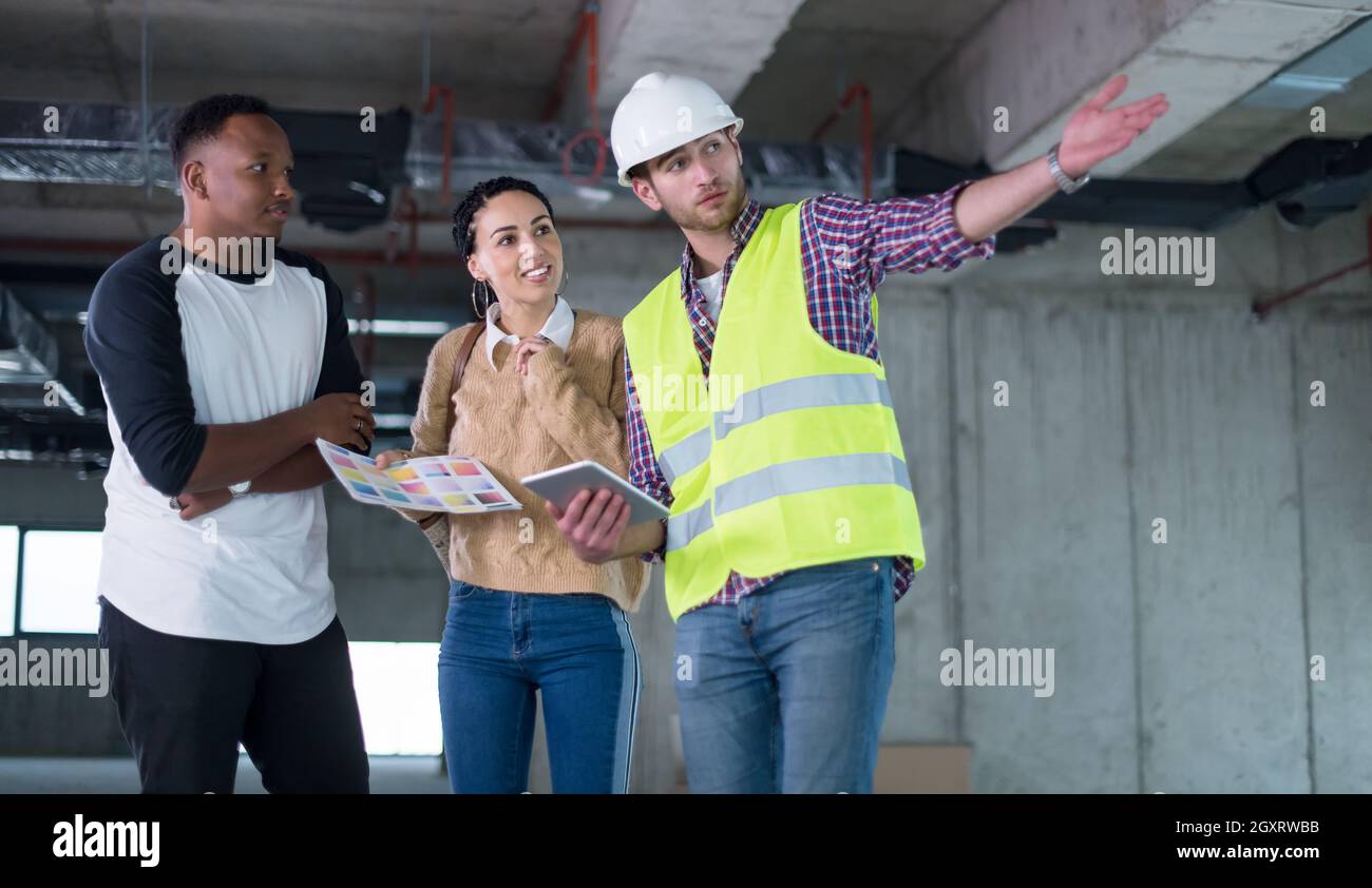 architect engineer using tablet computer while showing house design ...