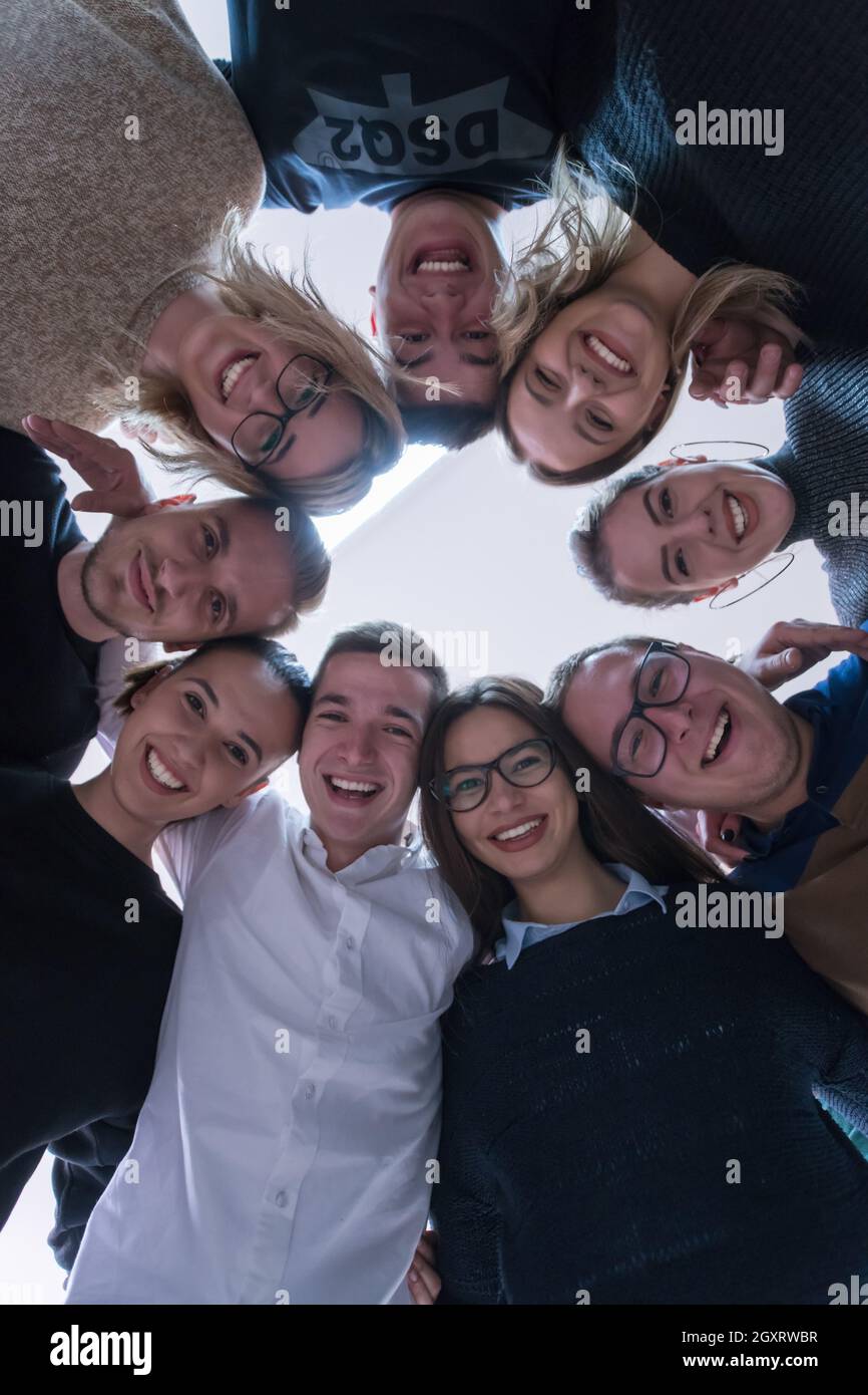 Group of young students in electronics classroom celebrating ...