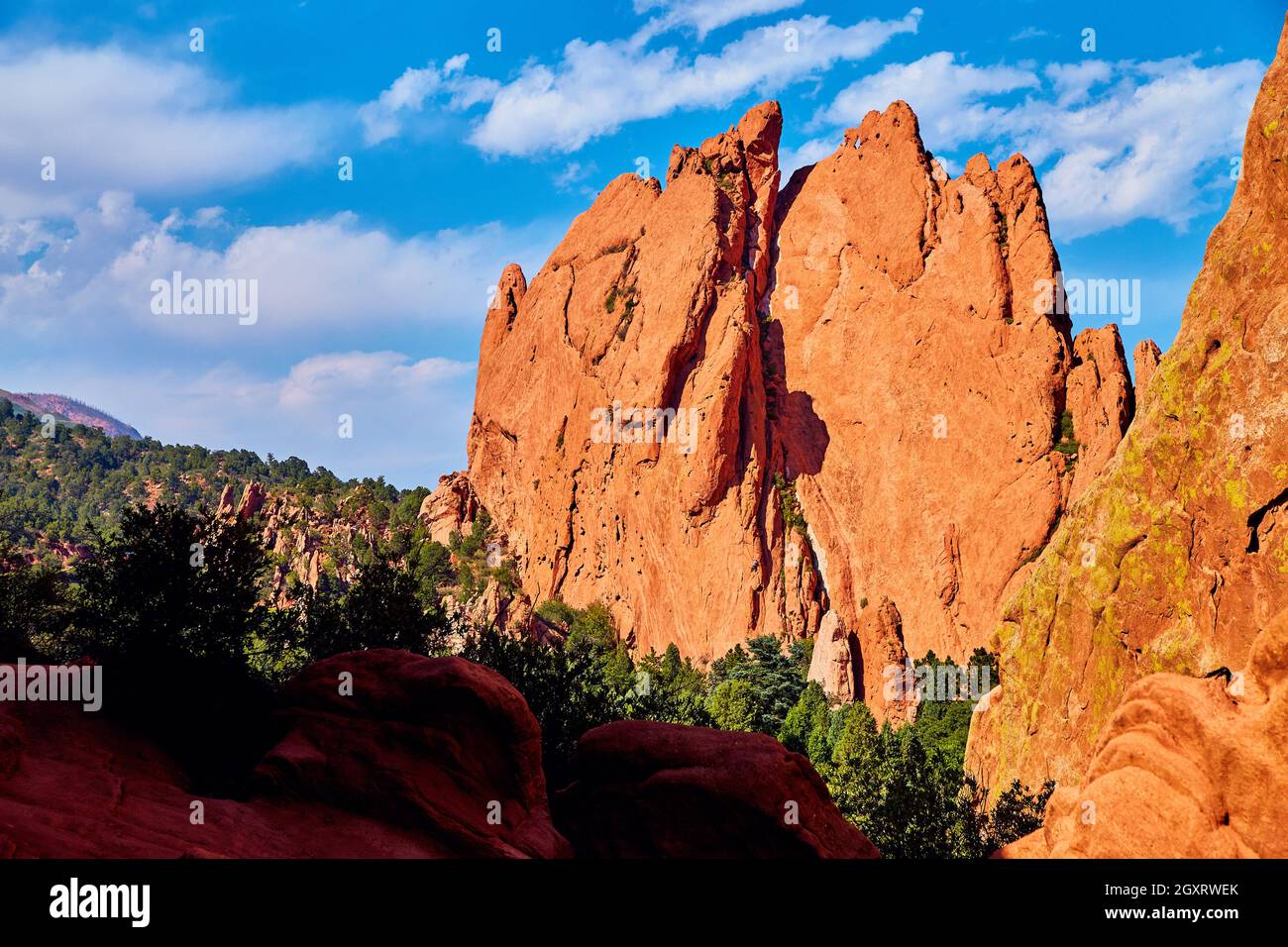 Giant red rock vertical pillar mountain in desert Stock Photo - Alamy
