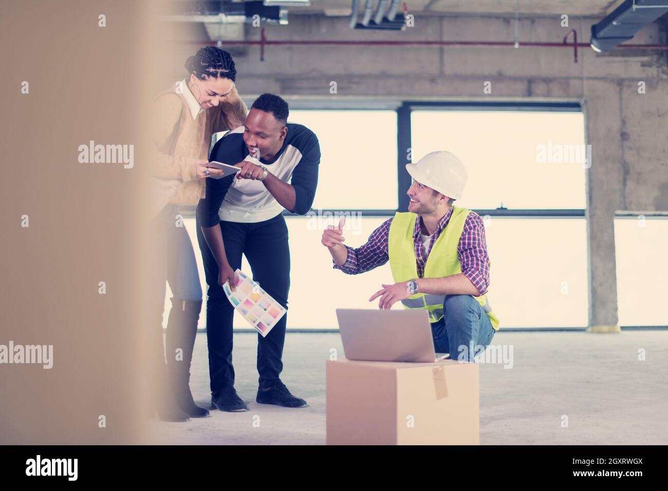 architect engineer using laptop computer while showing house design ...