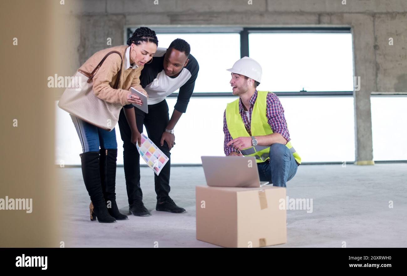 architect engineer using laptop computer while showing house design ...