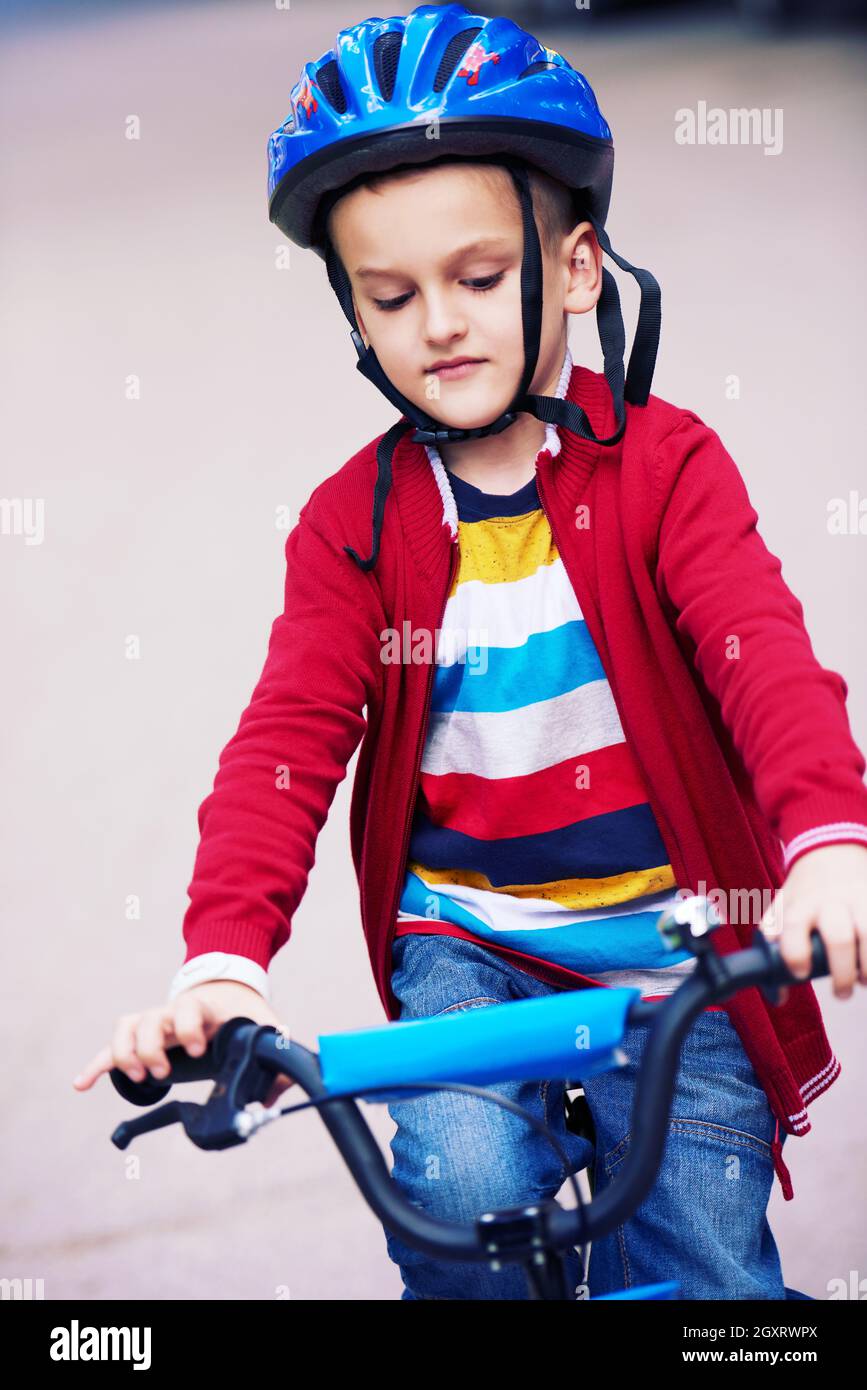 Young boy on the bicycle at Park Stock Photo - Alamy