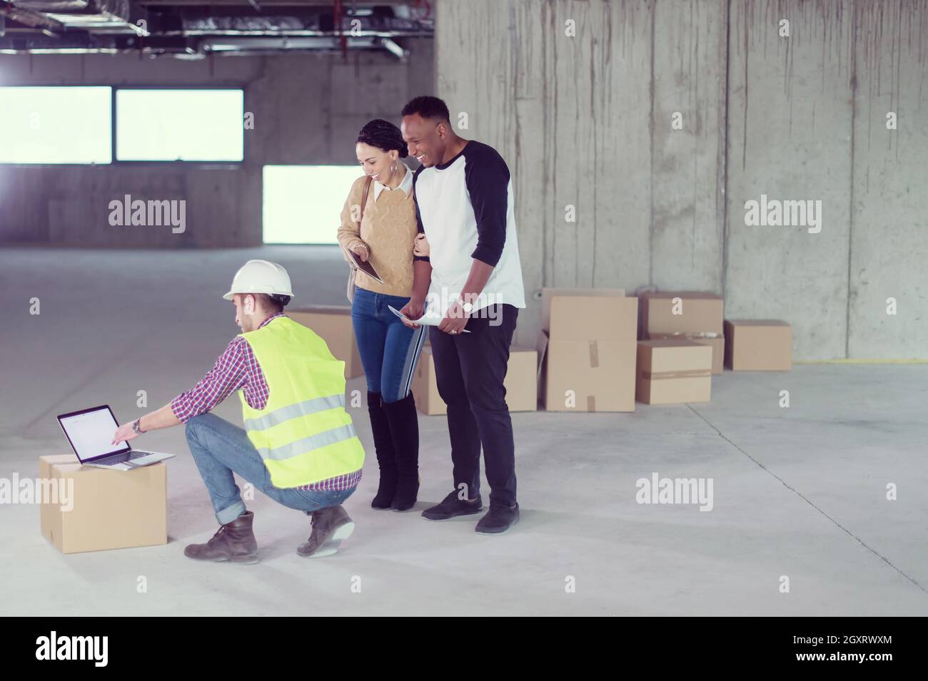 architect engineer using laptop computer while showing house design ...
