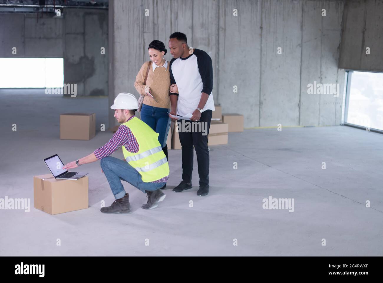 architect engineer using laptop computer while showing house design ...