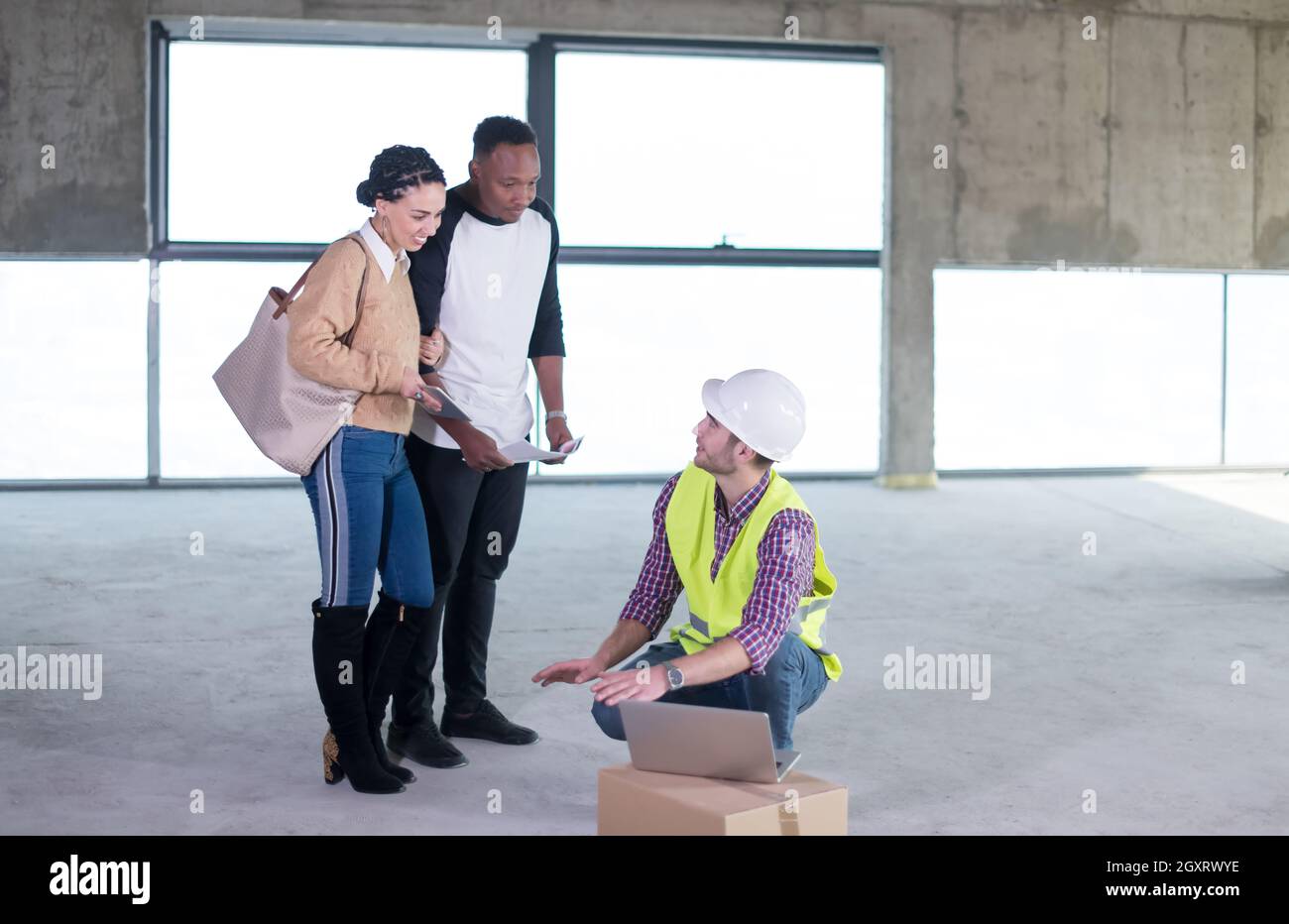 architect engineer using laptop computer while showing house design ...