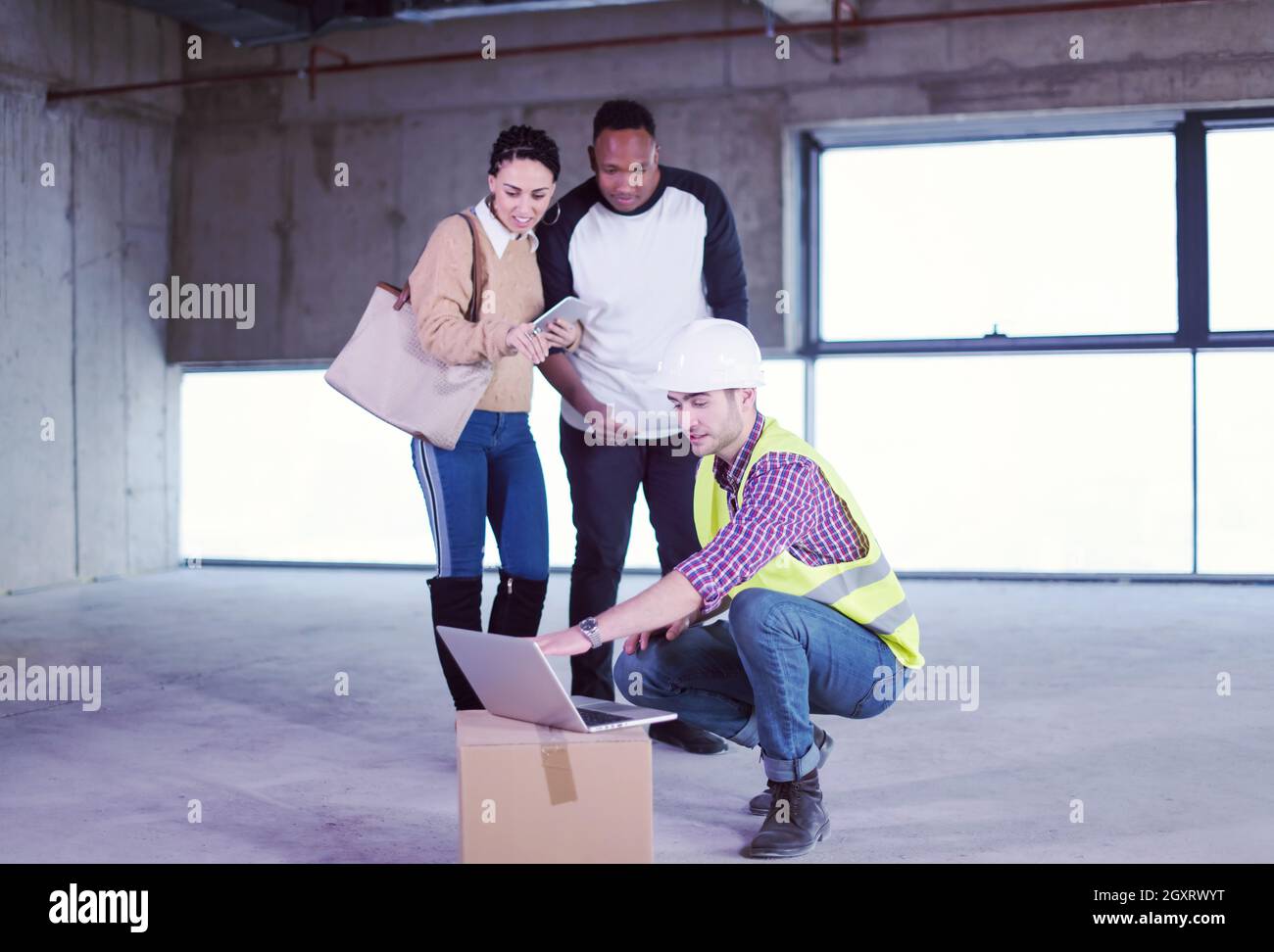 architect engineer using laptop computer while showing house design ...