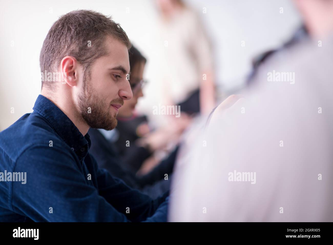 Group of young students doing technical vocational practice with ...