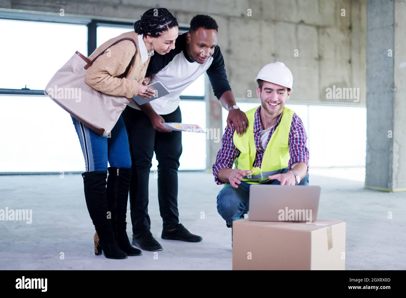 architect engineer using laptop computer while showing house design ...