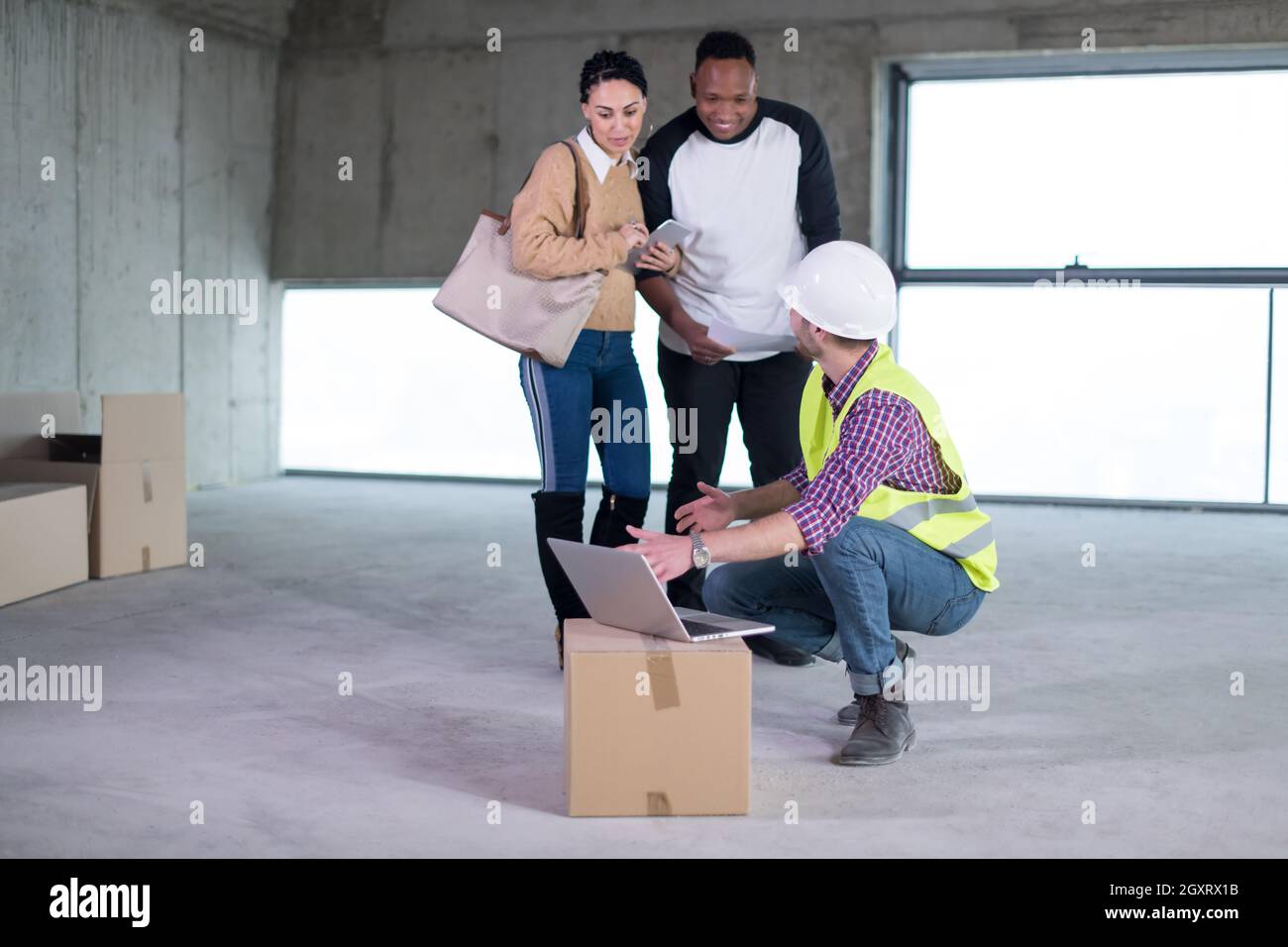 architect engineer using laptop computer while showing house design ...