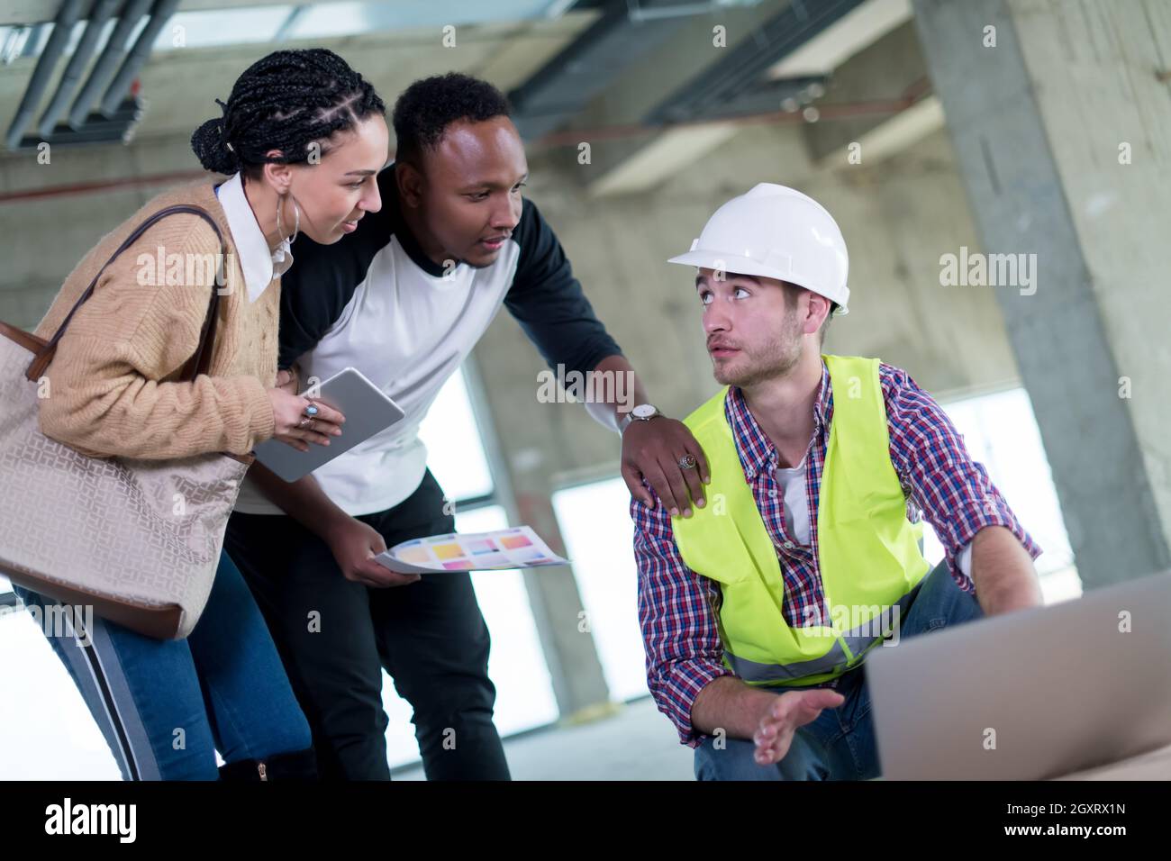 architect engineer using laptop computer while showing house design ...