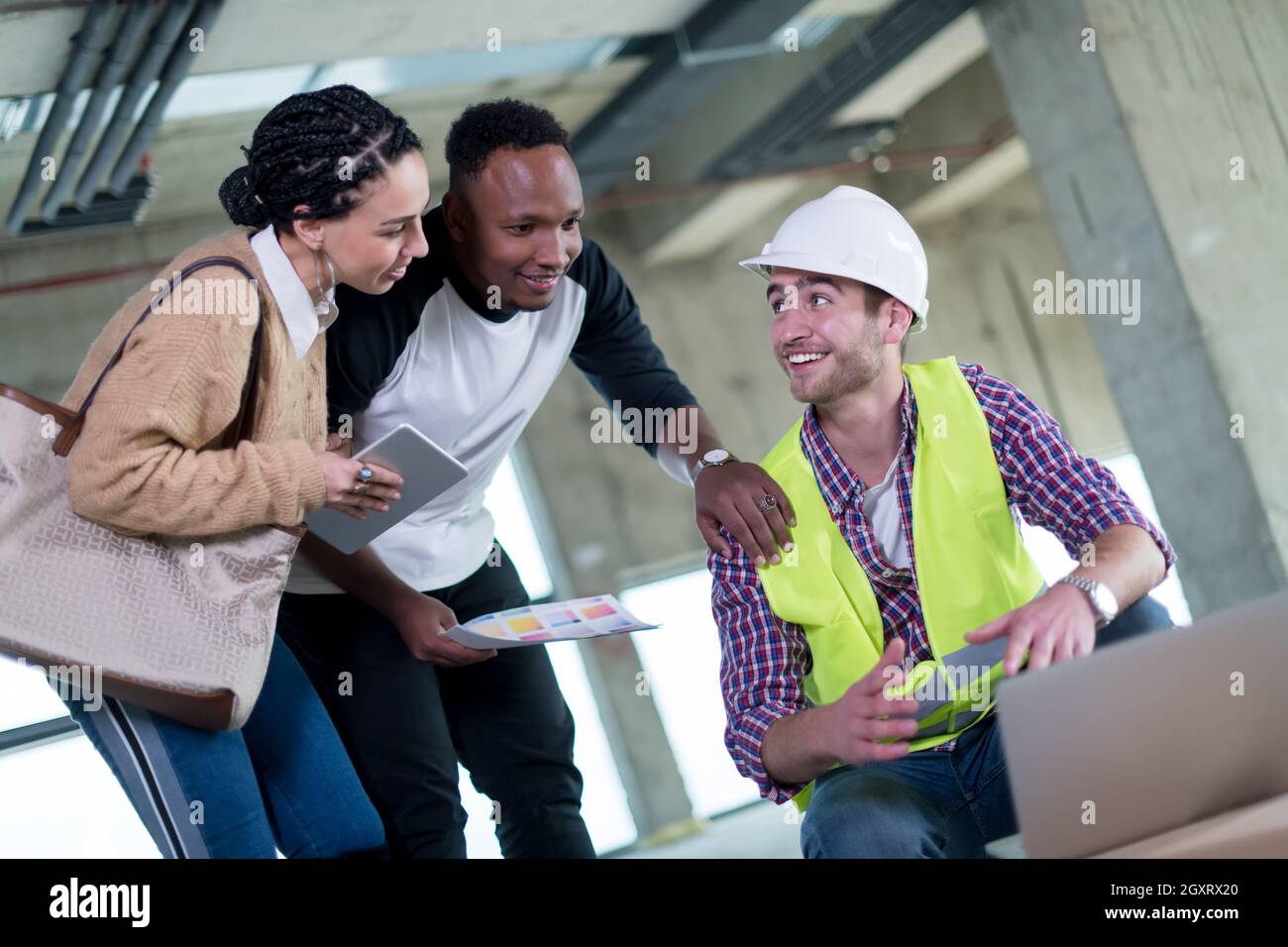 architect engineer using laptop computer while showing house design ...
