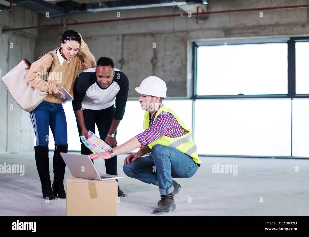 architect engineer using laptop computer while showing house design ...