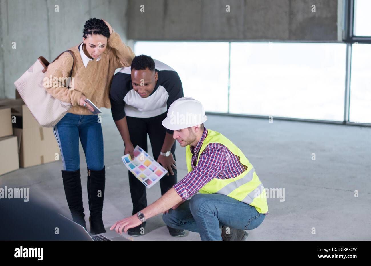 architect engineer using laptop computer while showing house design ...