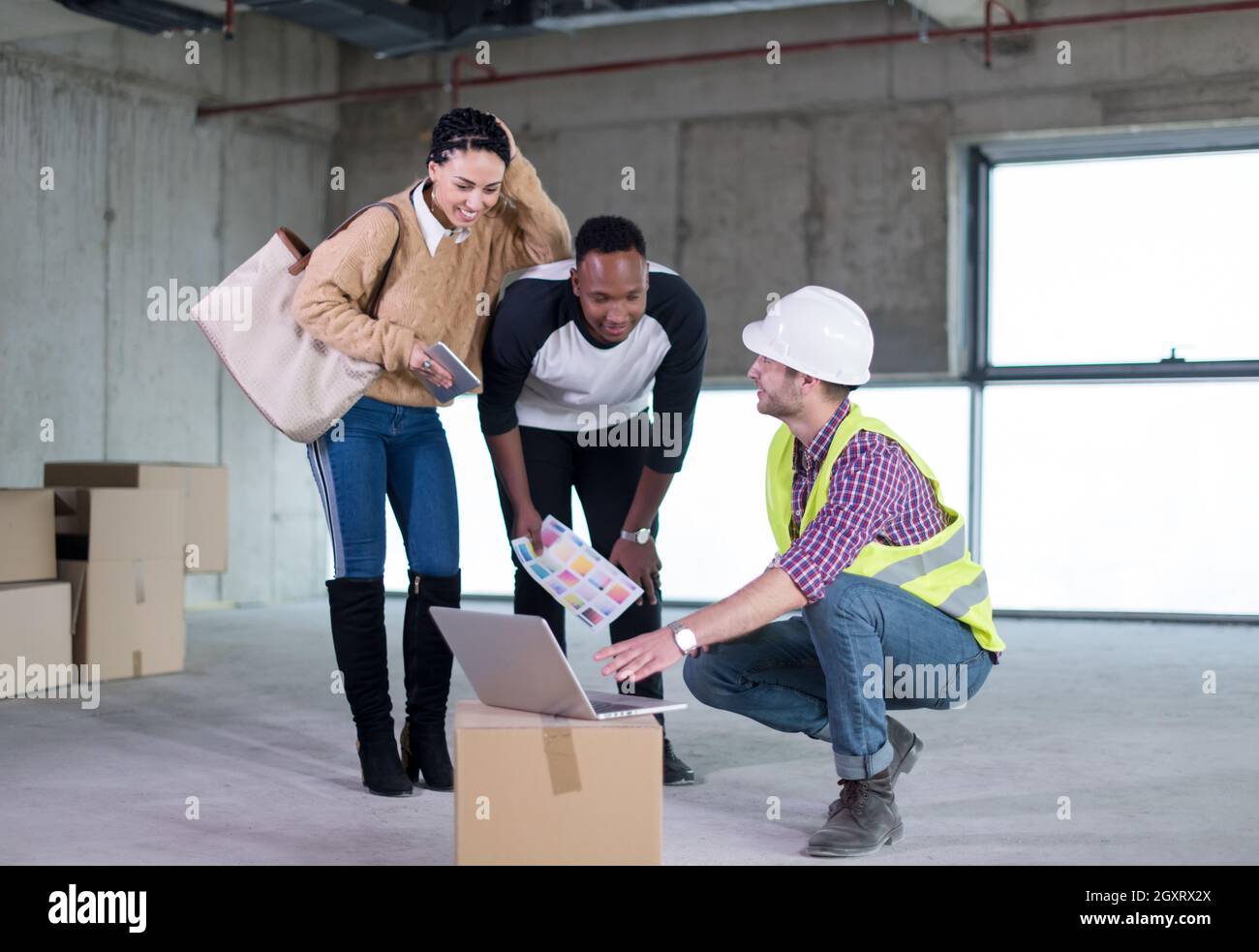 architect engineer using laptop computer while showing house design ...