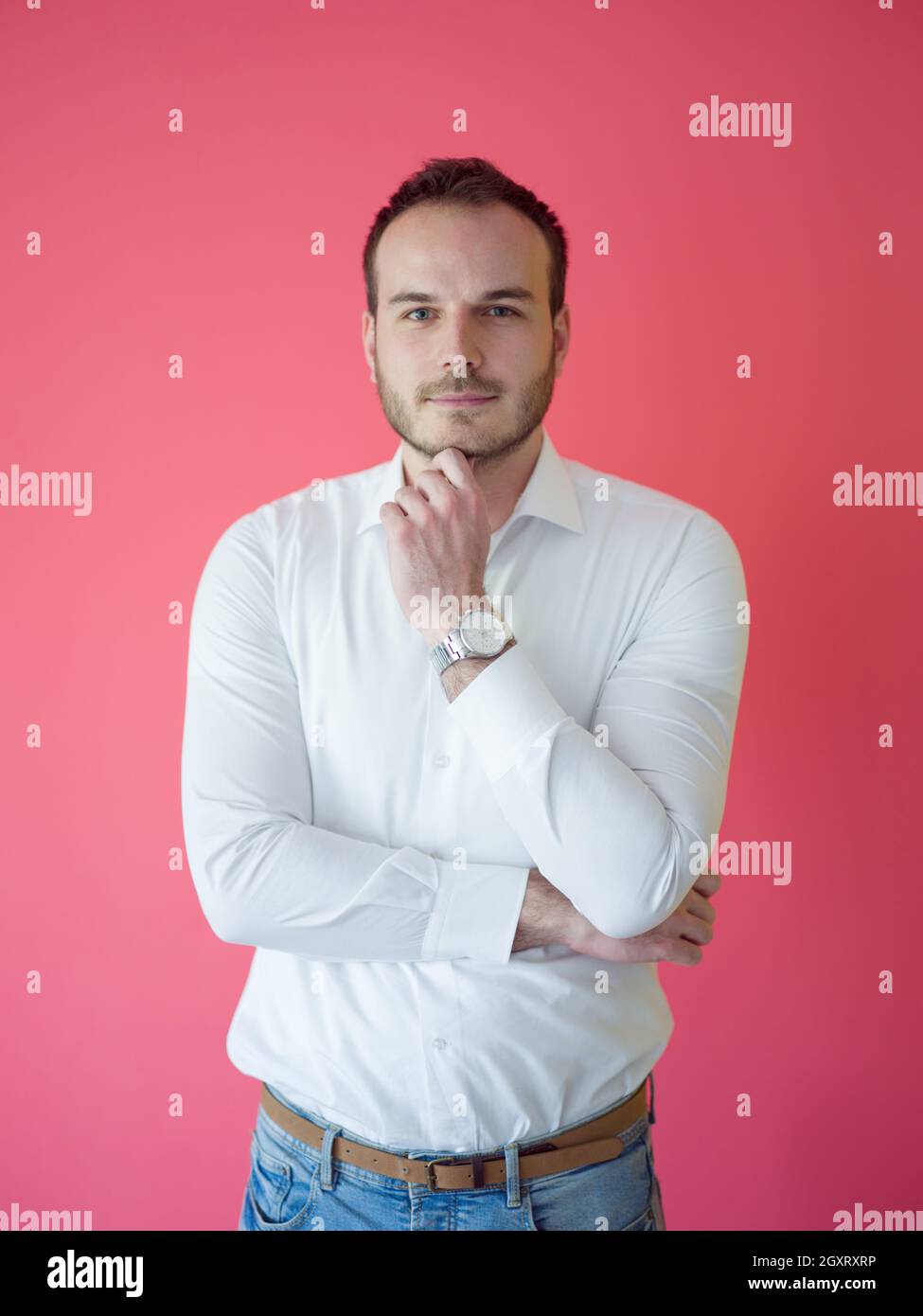 portrait of a handsome young man isolated over a red background Stock ...
