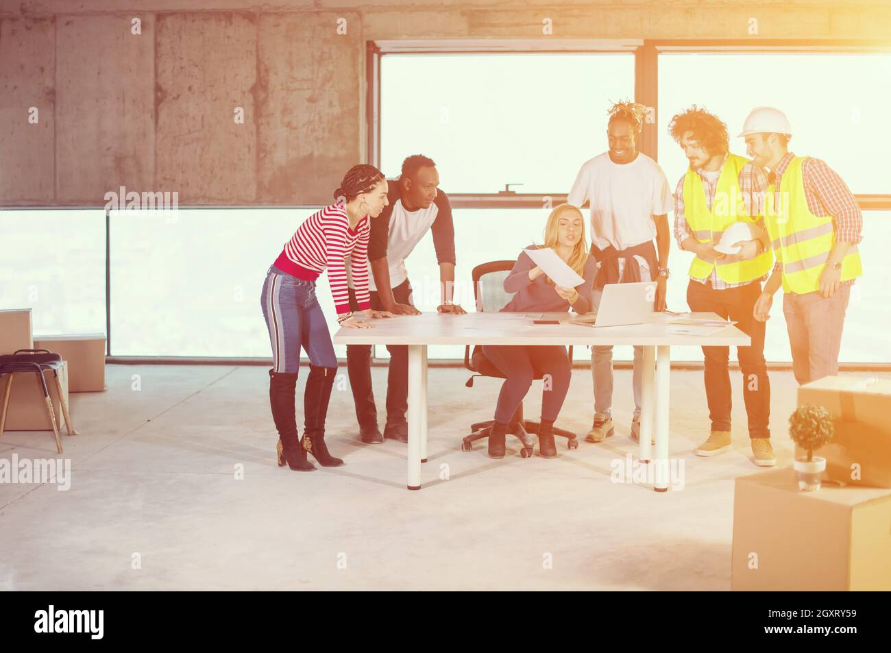 young multiethnic team of business people in group checking documents ...