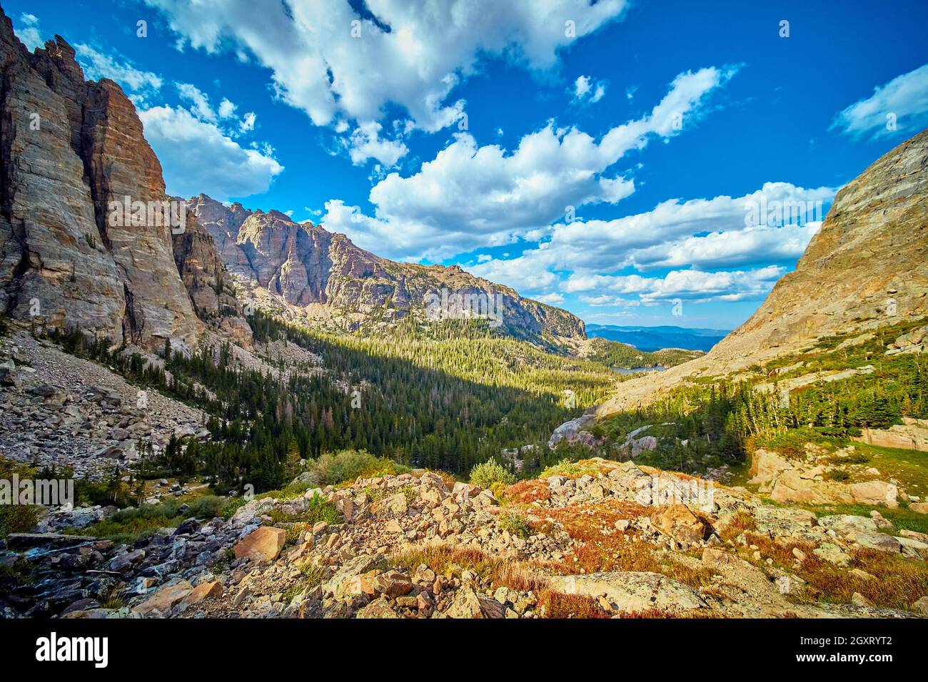 Rocky mountains view up high of valley and lake Stock Photo - Alamy