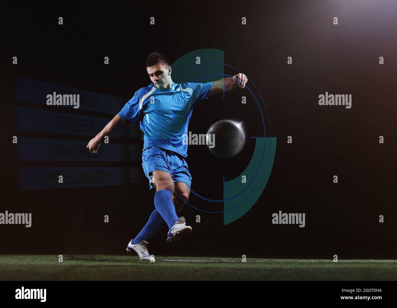 soccer player doing kick with ball on football stadium field isolated on black background Stock ...