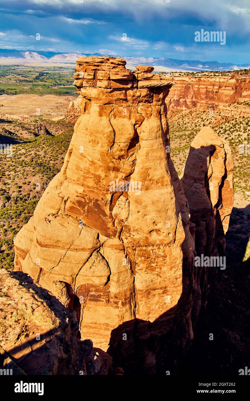 Desert canyon large red pillar of rock with valley in background Stock ...