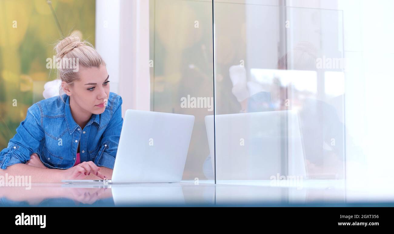 beautiful young women using laptop computer on the floor of her luxury ...
