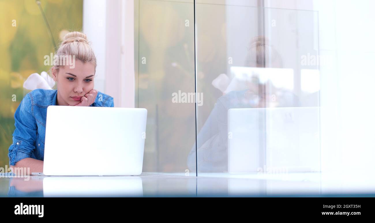 beautiful young women using laptop computer on the floor of her luxury ...