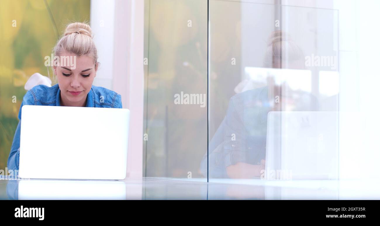 beautiful young women using laptop computer on the floor of her luxury ...