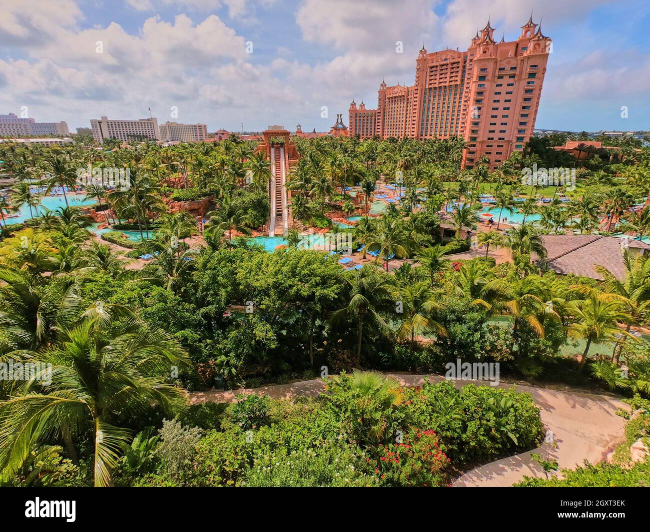 High up view of tropical resort with lush green gardens and ...