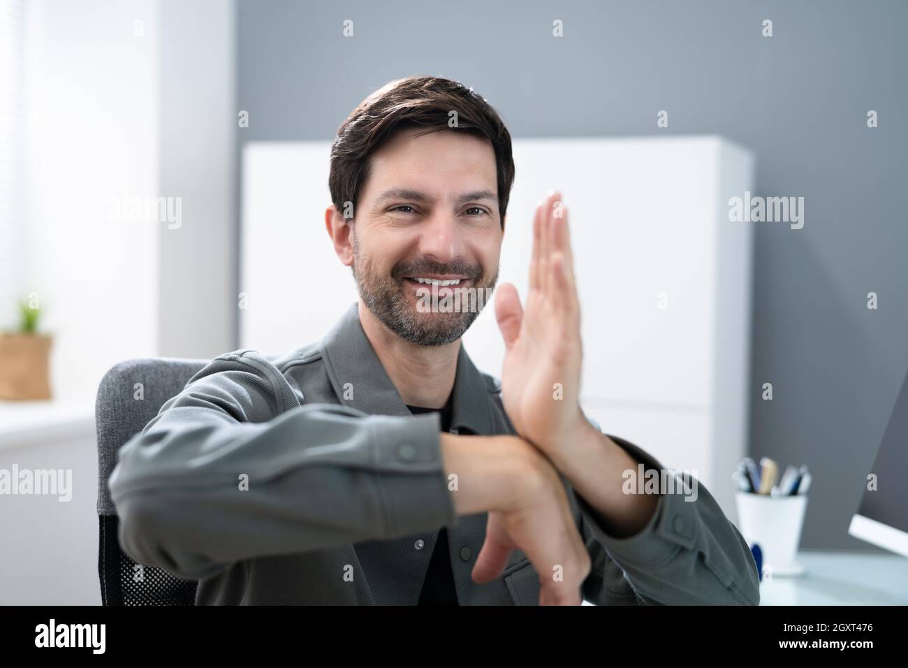 Adult Learning Sign Language For Deaf Disabled Stock Photo - Alamy