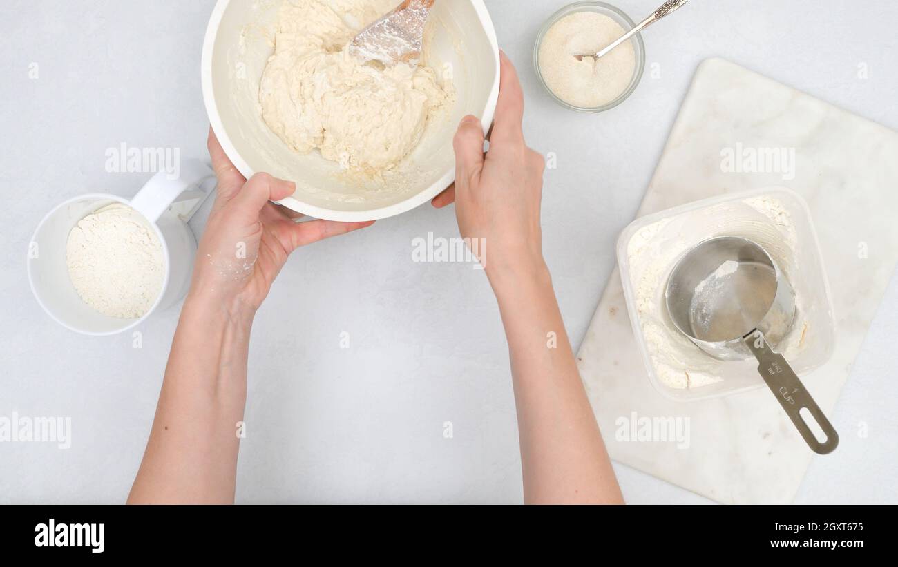Bread dough recipe. Mixing dough in a bowl, step by step baking process ...