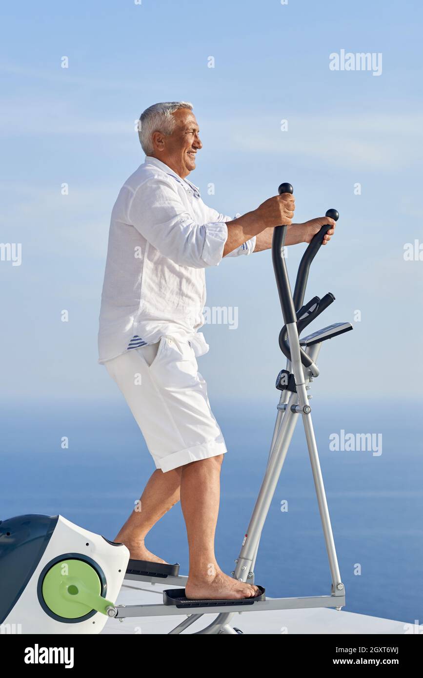 Older man running treadmill hi-res stock photography and images - Alamy