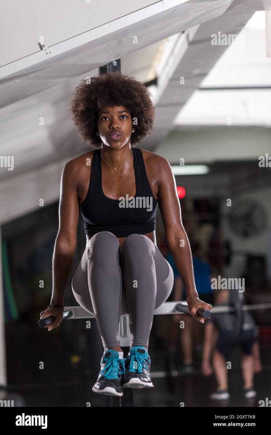 african american athlete woman workout out arms on dips horizontal ...