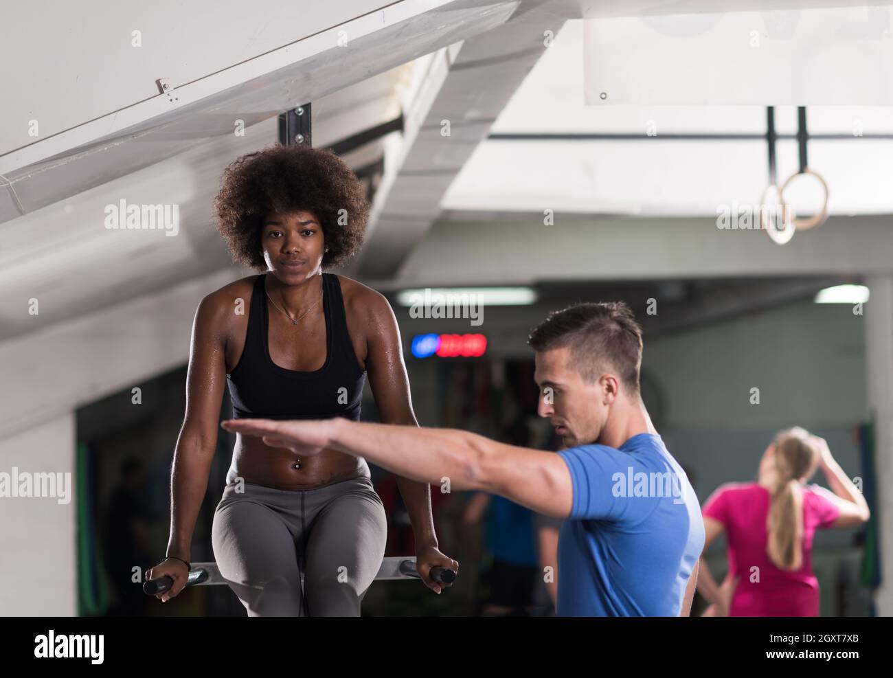 african american athlete woman workout out arms on dips horizontal ...