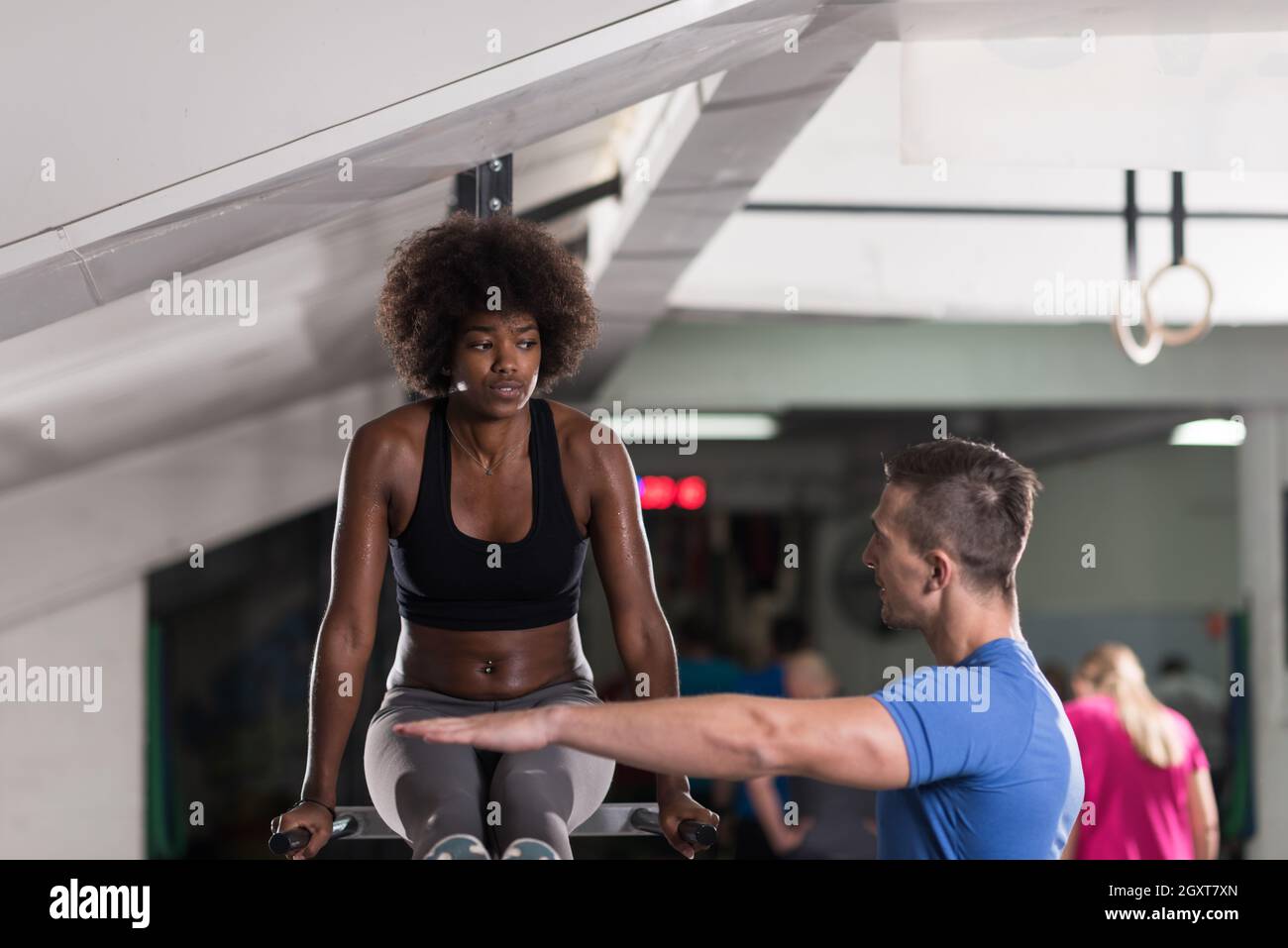 african american athlete woman workout out arms on dips horizontal ...