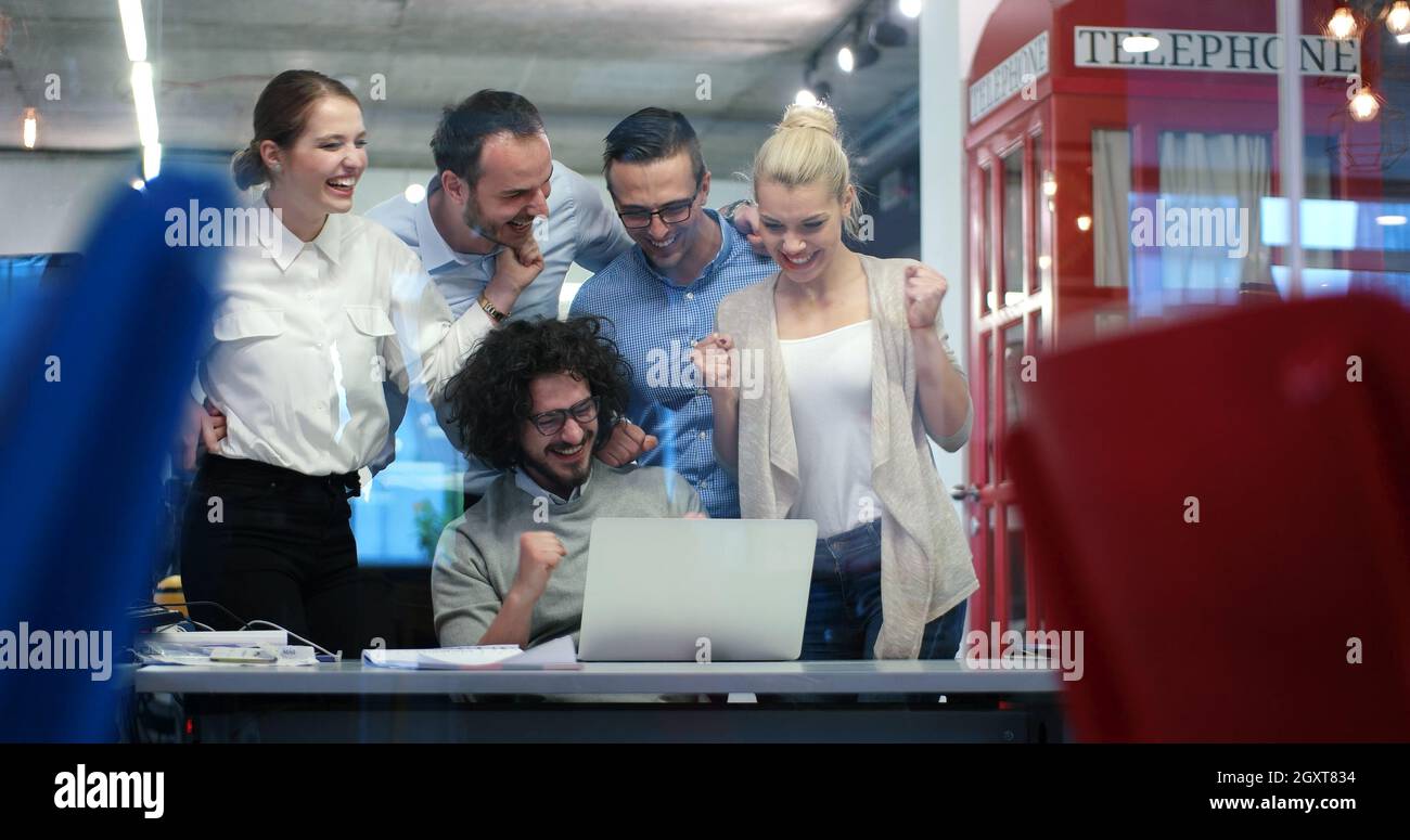 Group of a young business people discussing business plan at modern ...