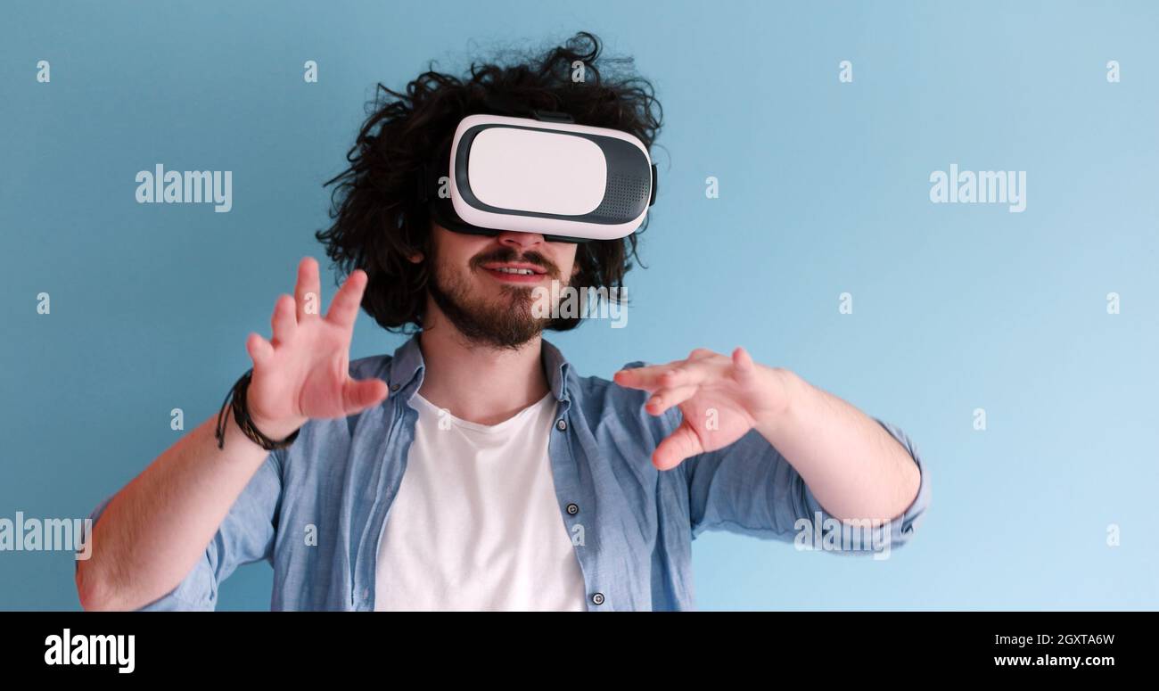Happy man getting experience using VR headset glasses of virtual ...