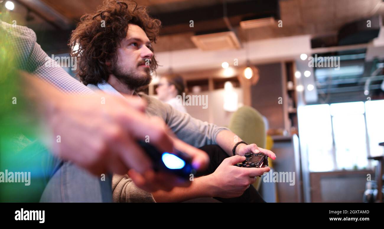 Work hard play hard. Office Workers Playing computer games Stock Photo ...