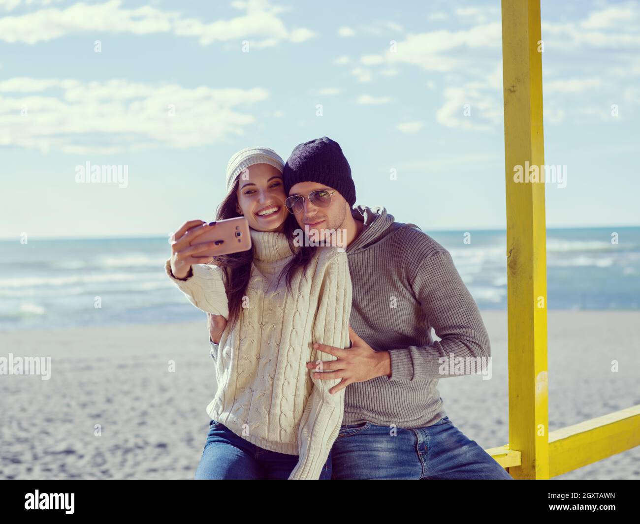 Very Happy Couple In Love Taking Selfie On The Beach In Autmun Day