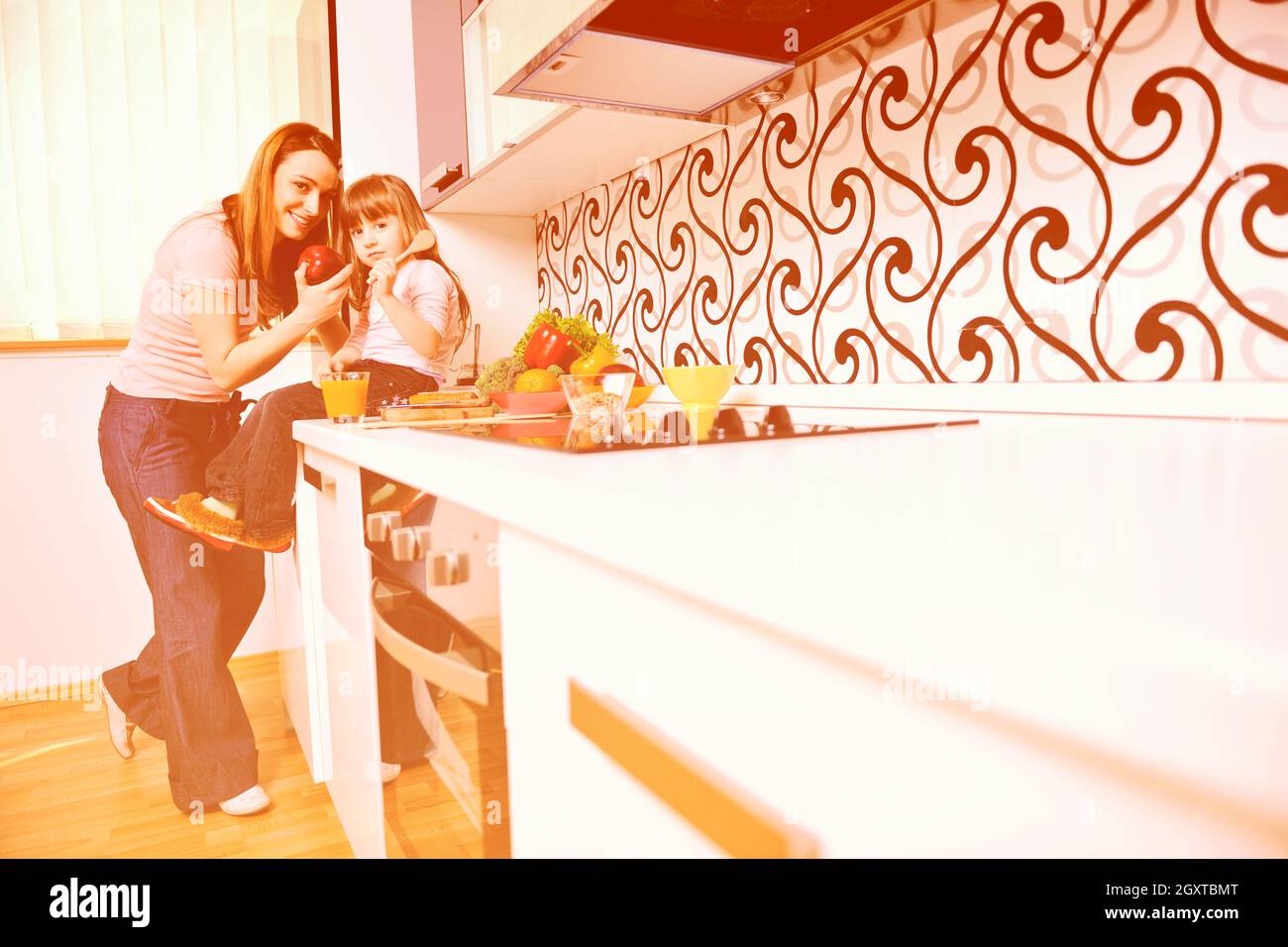 happy young family have lunch time with fresh fruits and vegetable food ...