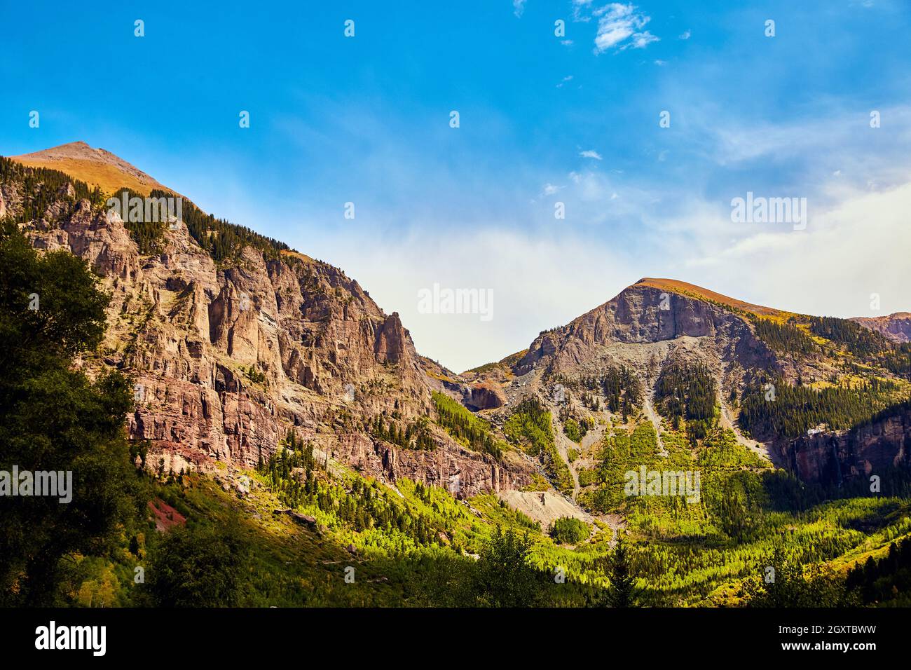 Large open canyon valley surrounded by rocky mountains Stock Photo - Alamy