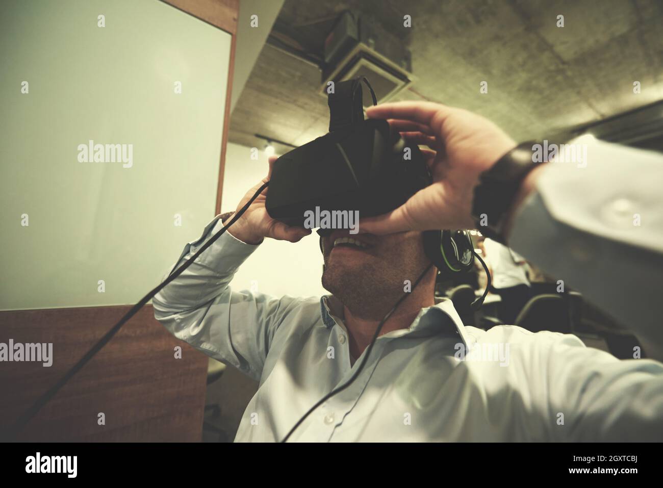 young man using virtual reality gadget computer technology glasses ...