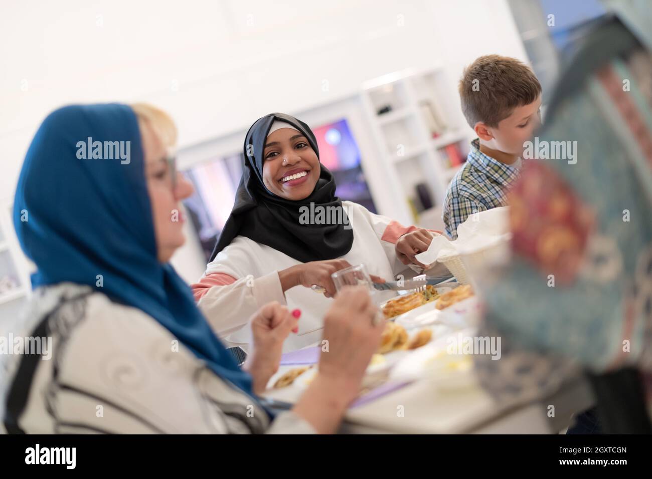 modern african american muslim woman enjoying iftar dinner together ...