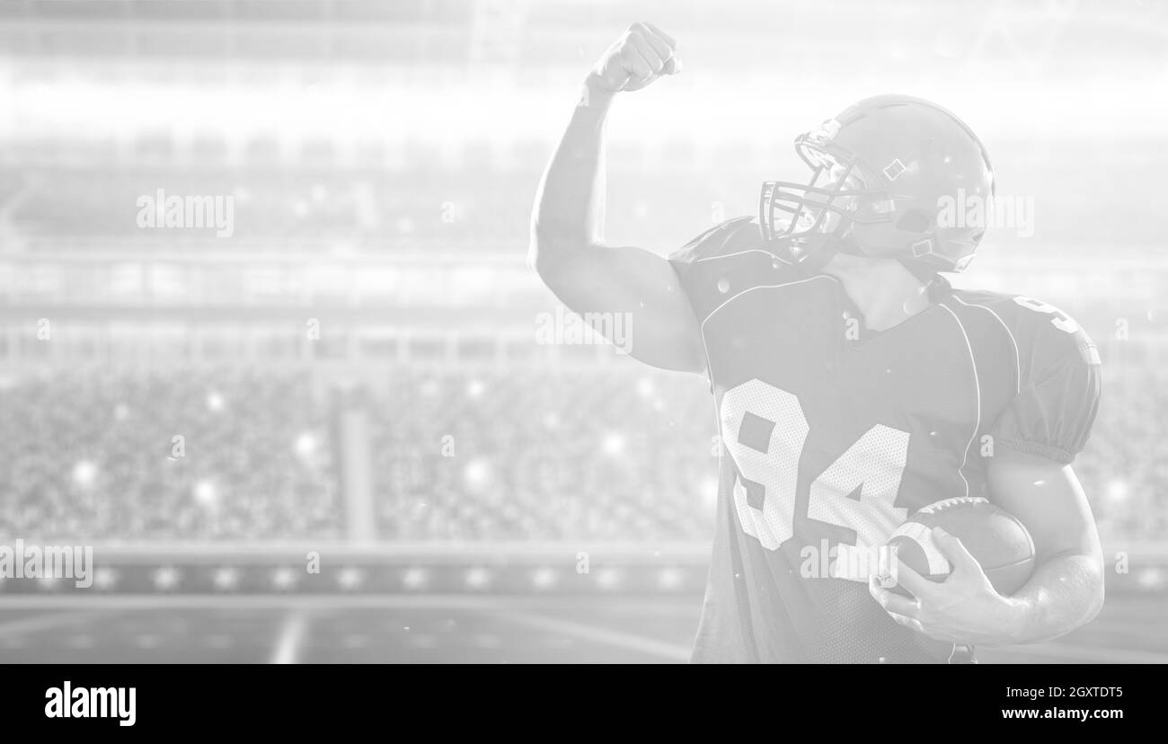 american football player celebrating touchdown on big modern stadium ...