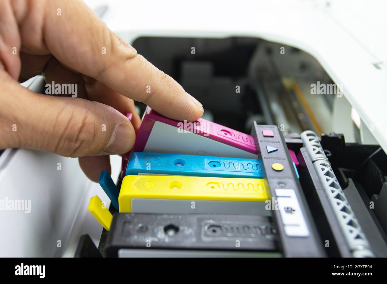 Technicians are install setup the ink cartridge of a inkjet printer the ...
