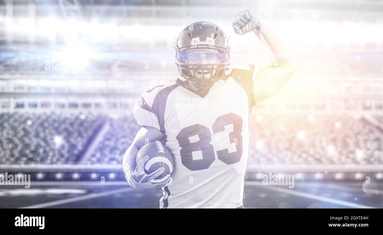 american football player celebrating touchdown on big modern stadium ...