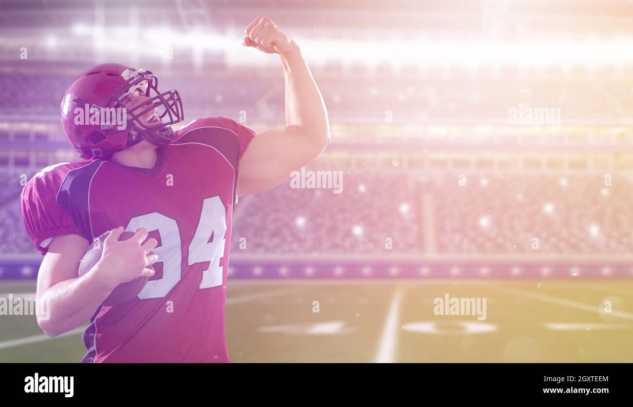 american football player celebrating touchdown on big modern stadium ...