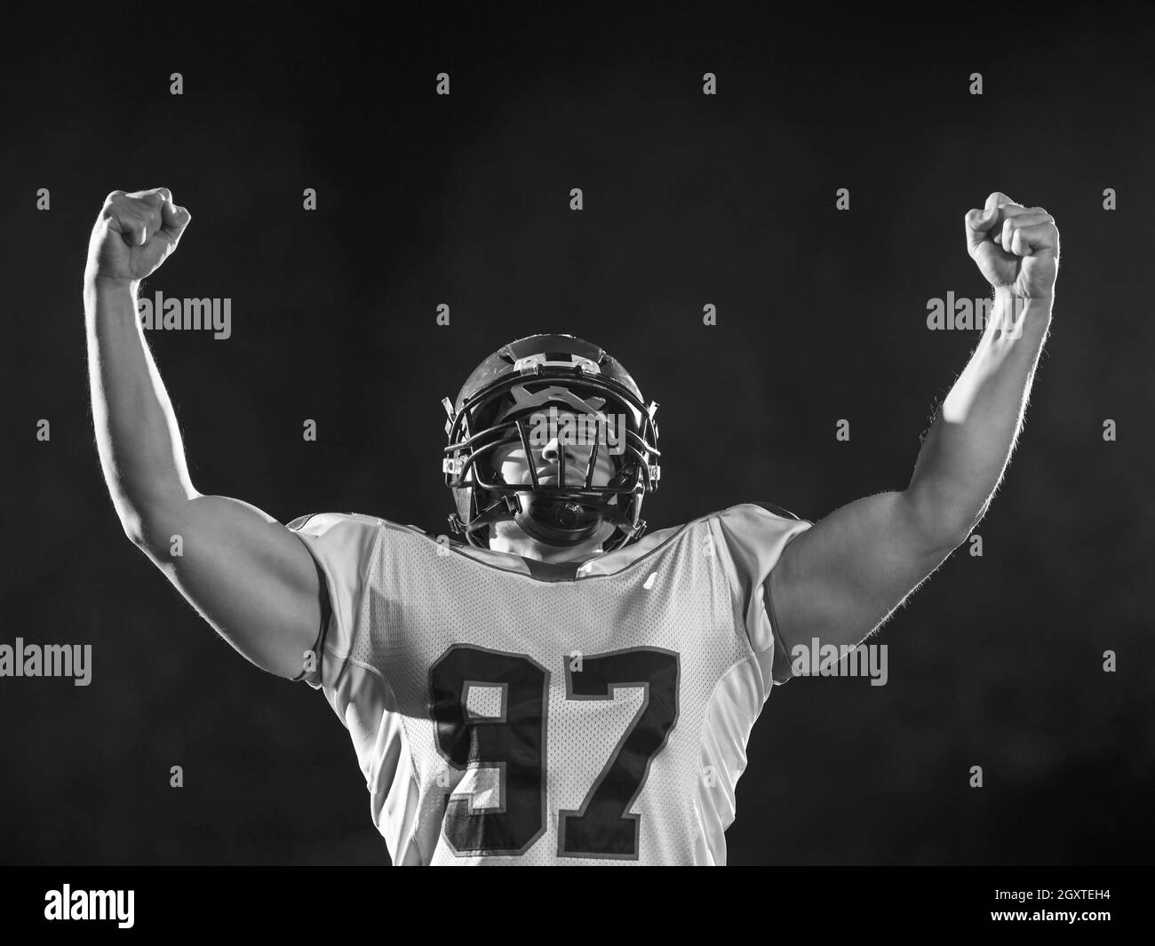 american football player celebrating after scoring a touchdown on field ...